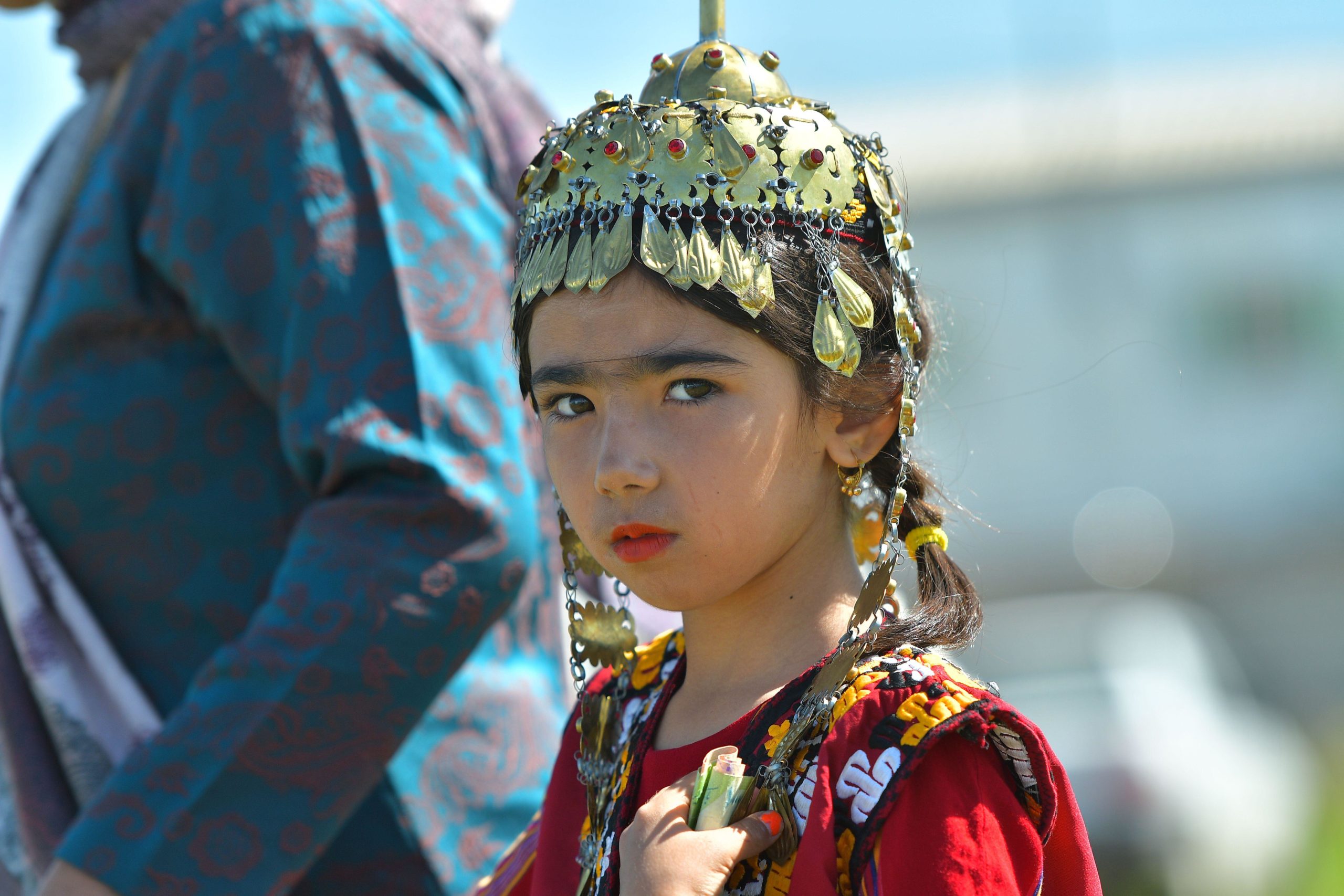 Turkmen girl in traditional clothes – The Tribune